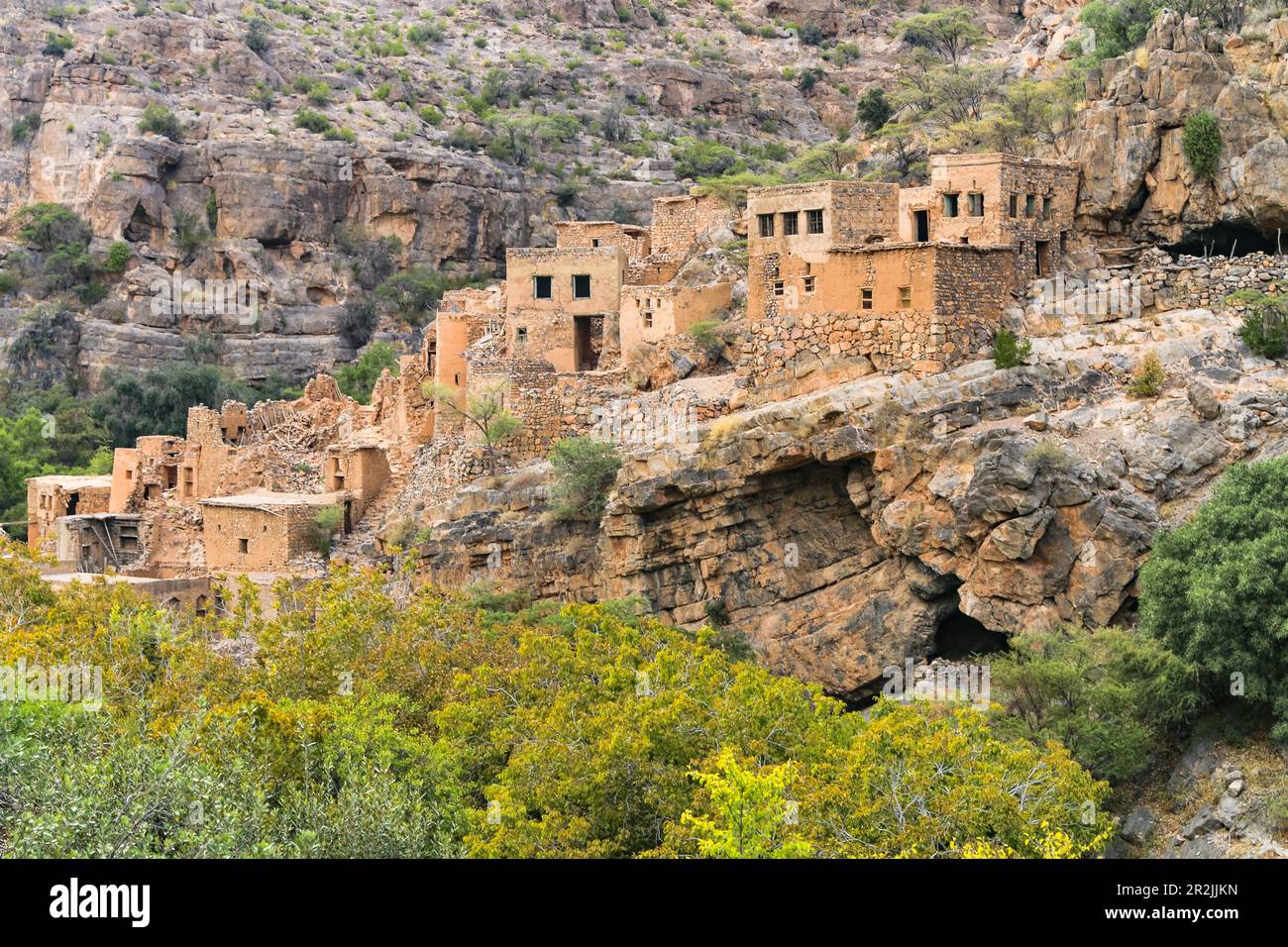 View of the ruins on the prominent rocks in the Wadi Bani Habib gorge ...