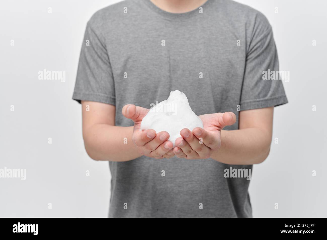young man washing his face with cleansing foam, men's skincare concept Stock Photo - Alamy