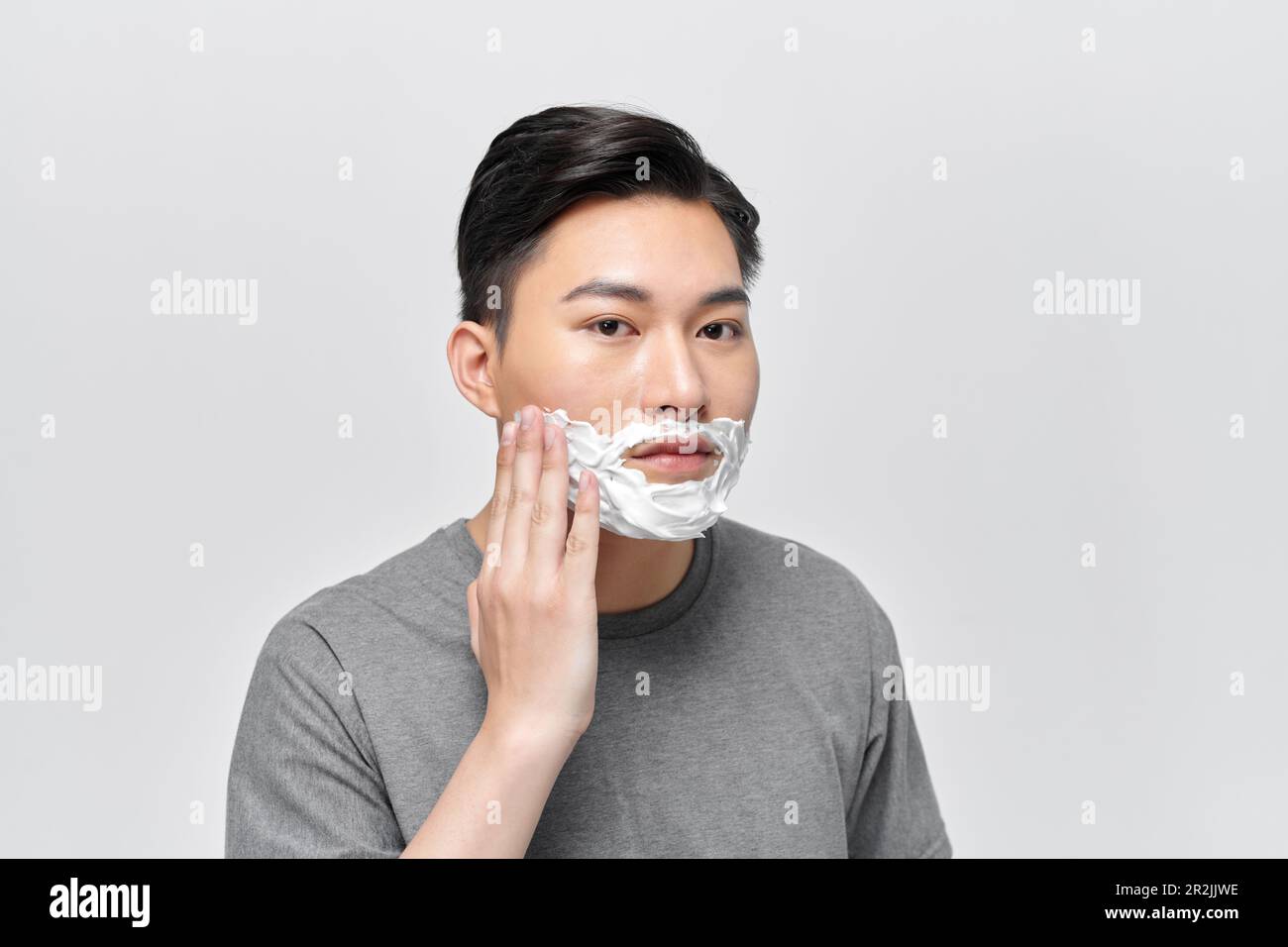 Asian man shaving in front hi-res stock photography and images - Alamy