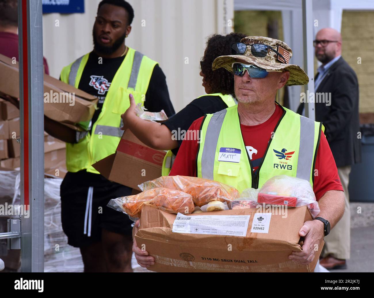 Orlando, United States. 19th May, 2023. Volunteers place food items in ...