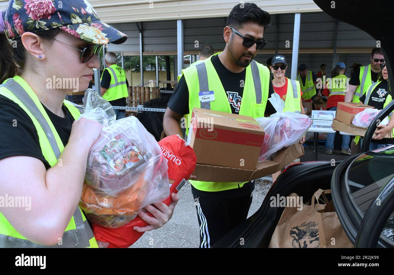 Orlando, United States. 19th May, 2023. Volunteers place food items in ...