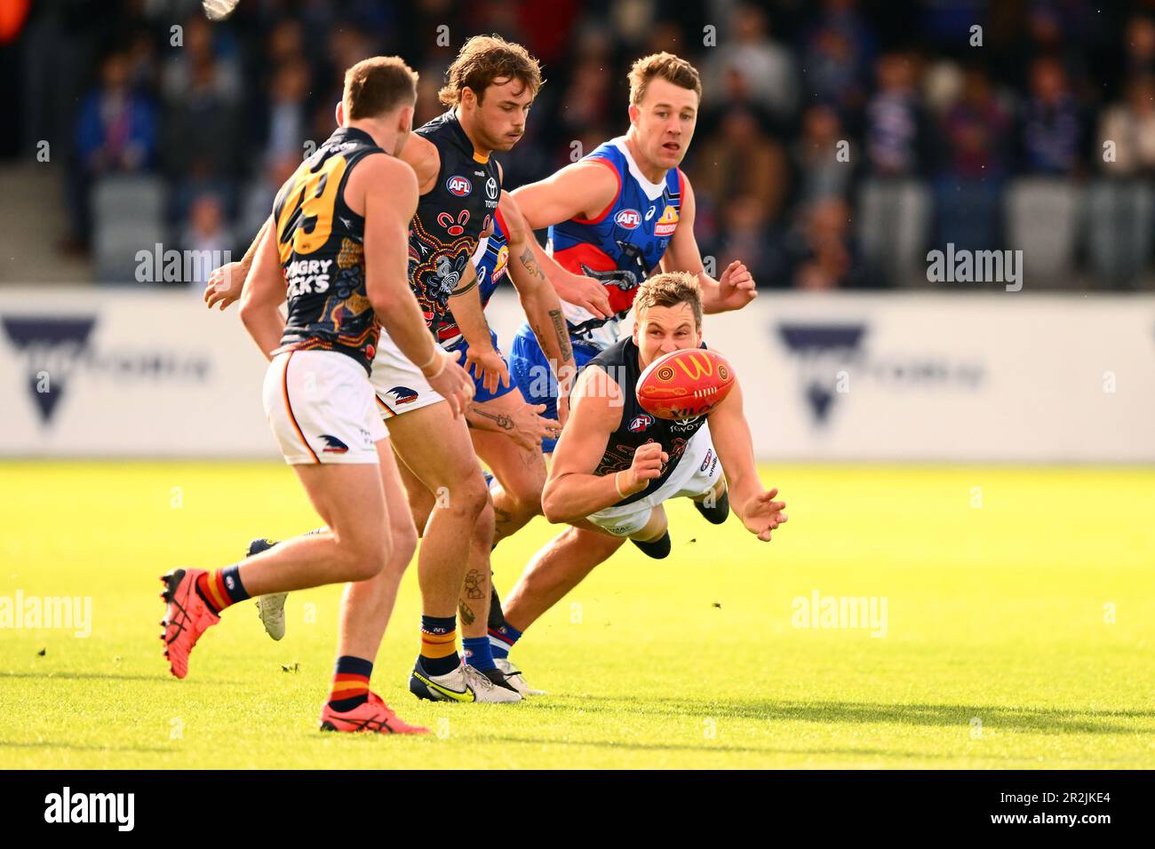 Jordan Dawson of the Crows handballs during the AFL Round 10 match ...