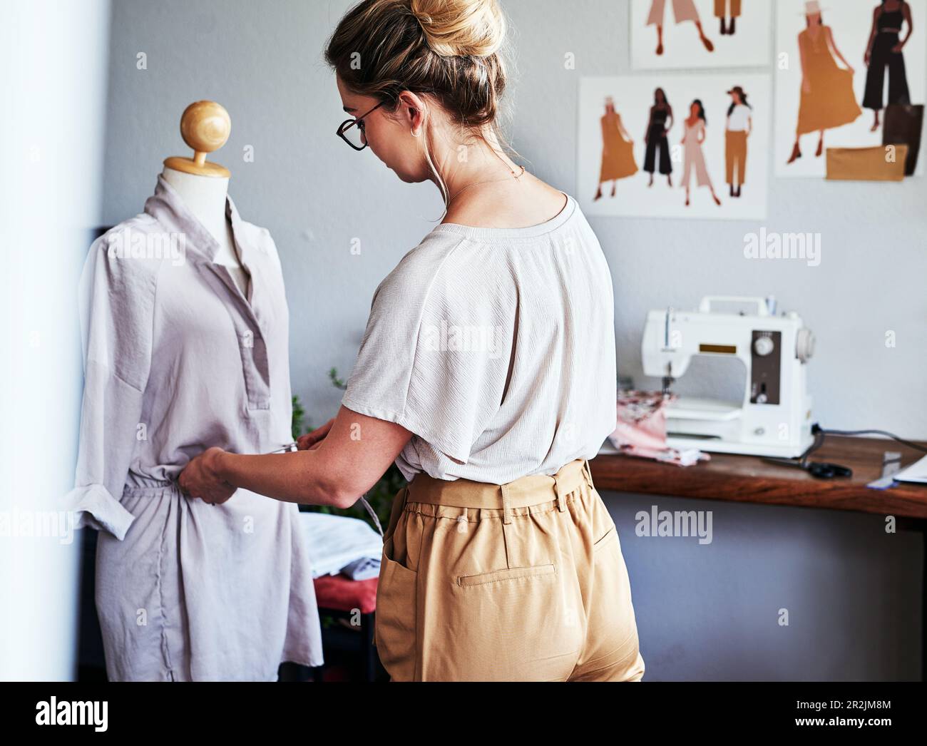 Fashion, woman and designer with mannequin, clothes and creative small ...