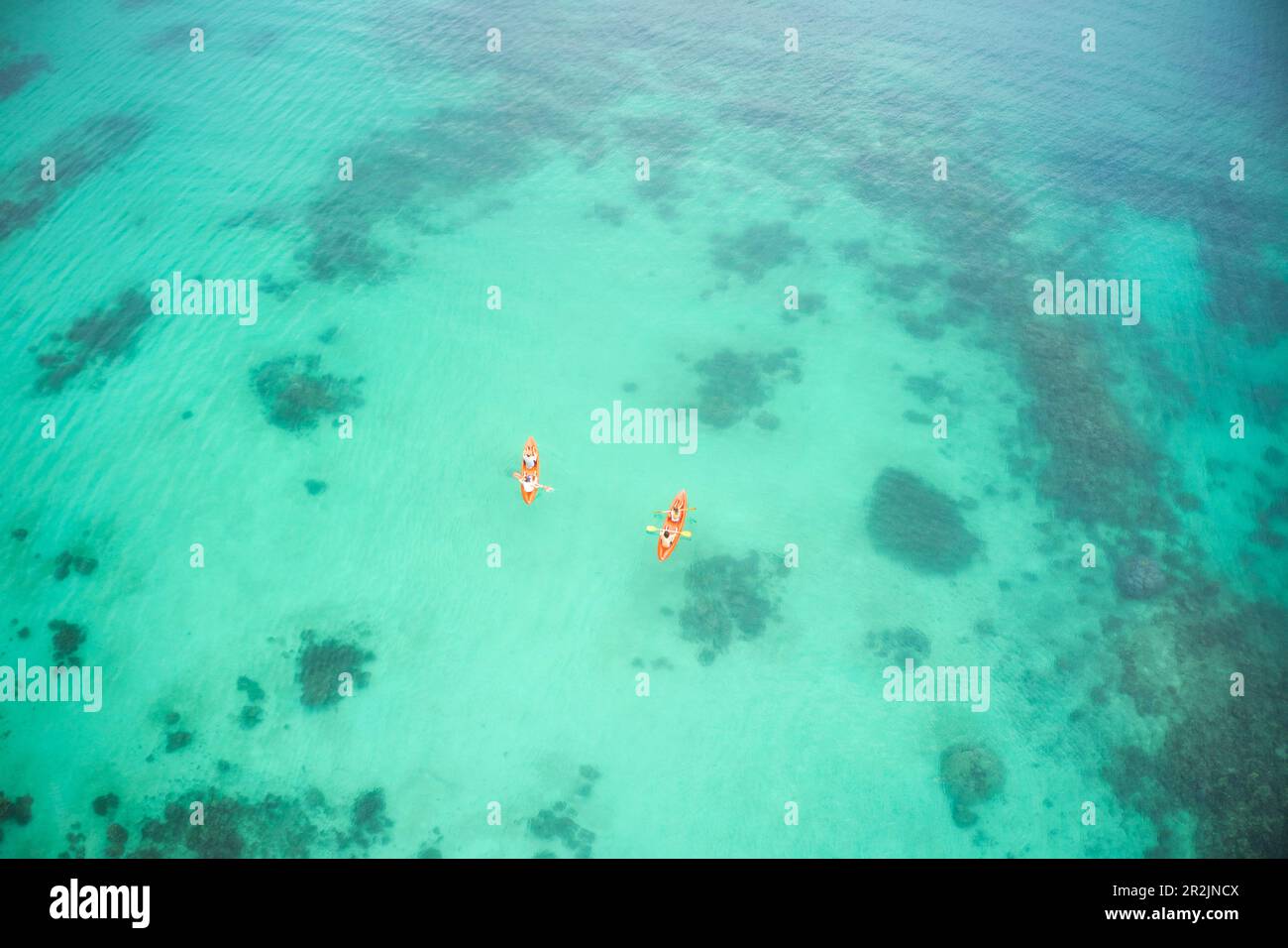Aerial boat and people in ocean for kayak adventure, travel or journey ...