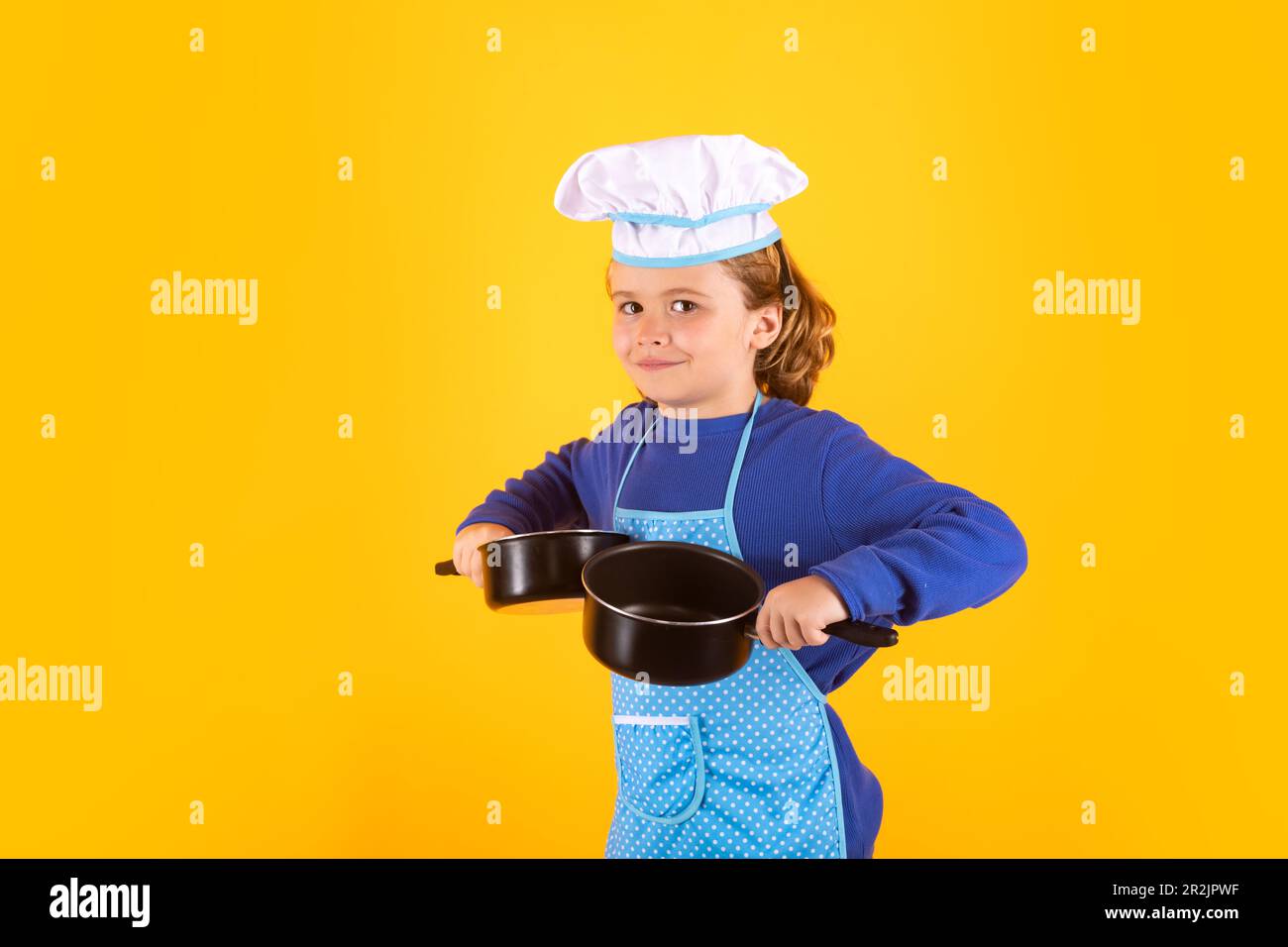 Kid chef cook with cooking pot stockpot. Kid chef cook prepares food on ...