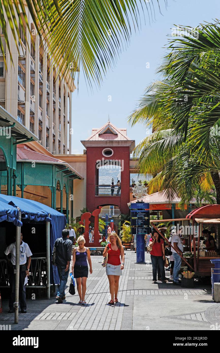 People in front of the Le Caudan Waterfront shopping center, Port Louis ...