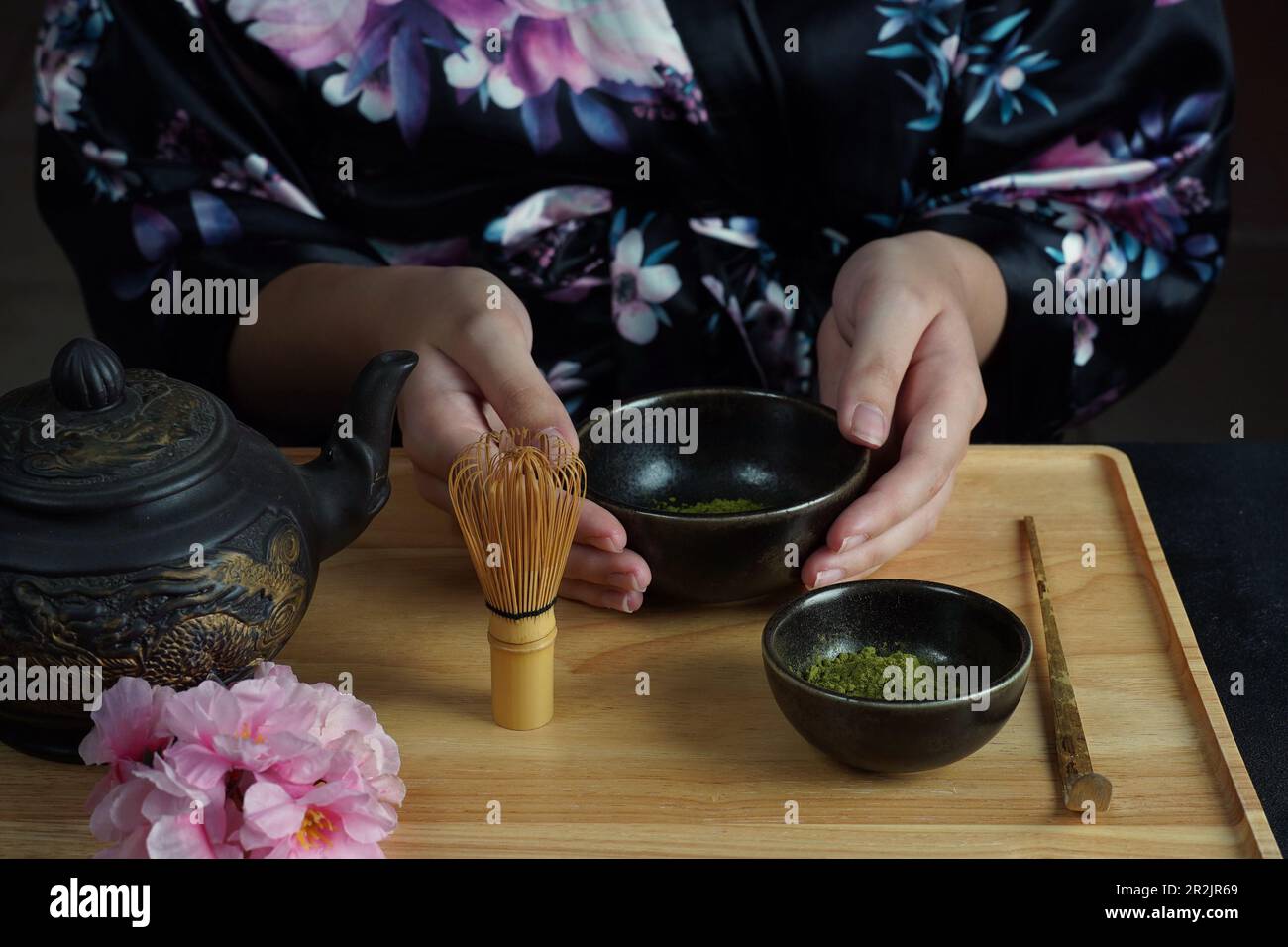 Woman tea master in kimono performs tea ceremony. Matcha green tea ...