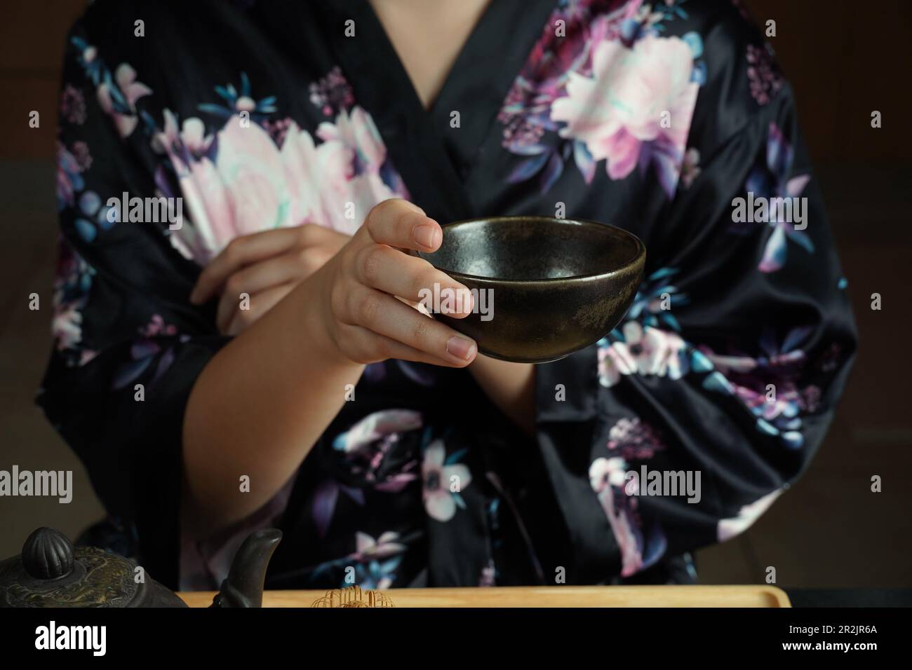 Woman tea master in kimono performs tea ceremony. Matcha green tea ...