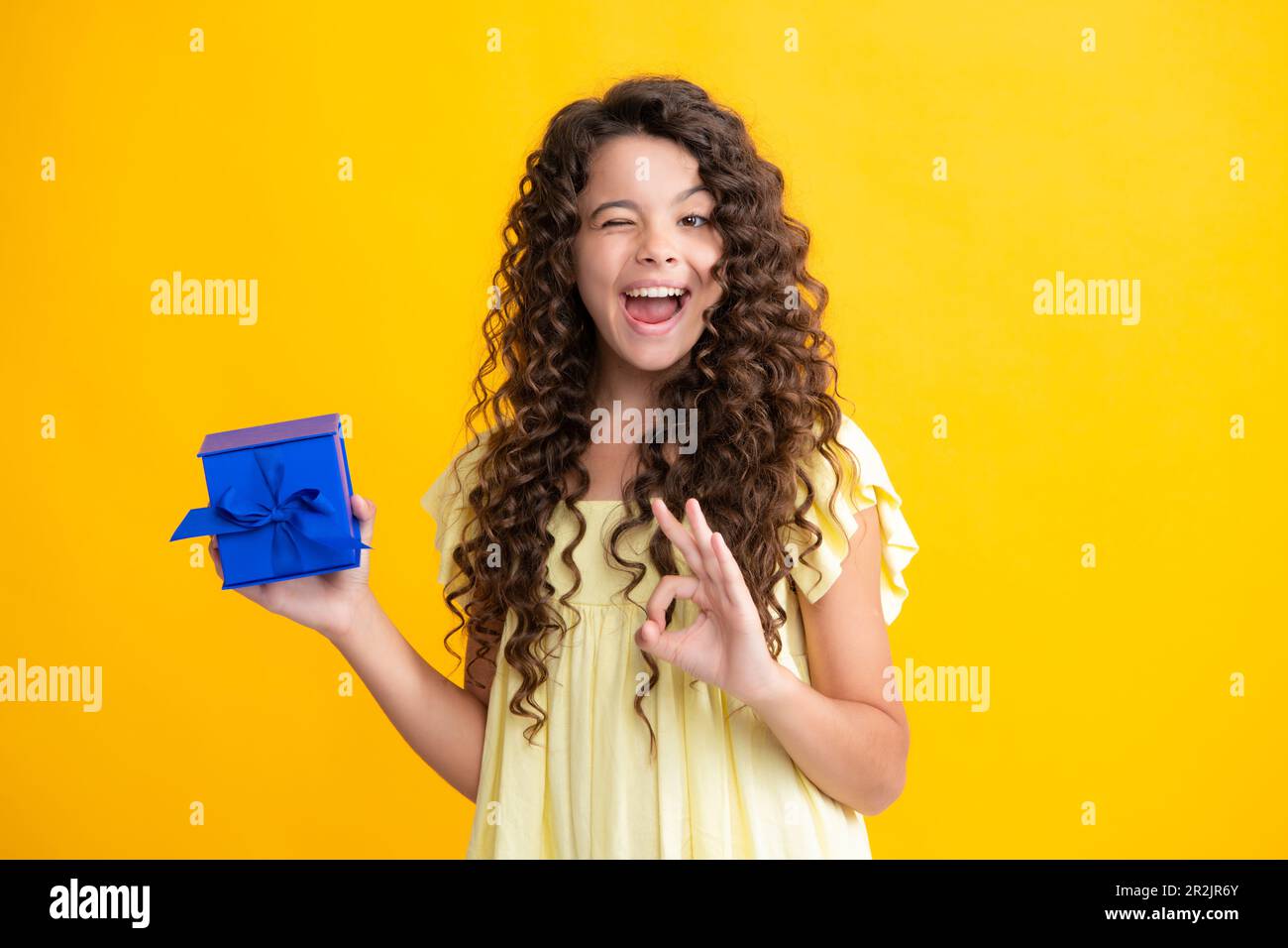 Teenager kid with present box. Teen girl giving birthday gift. Present ...