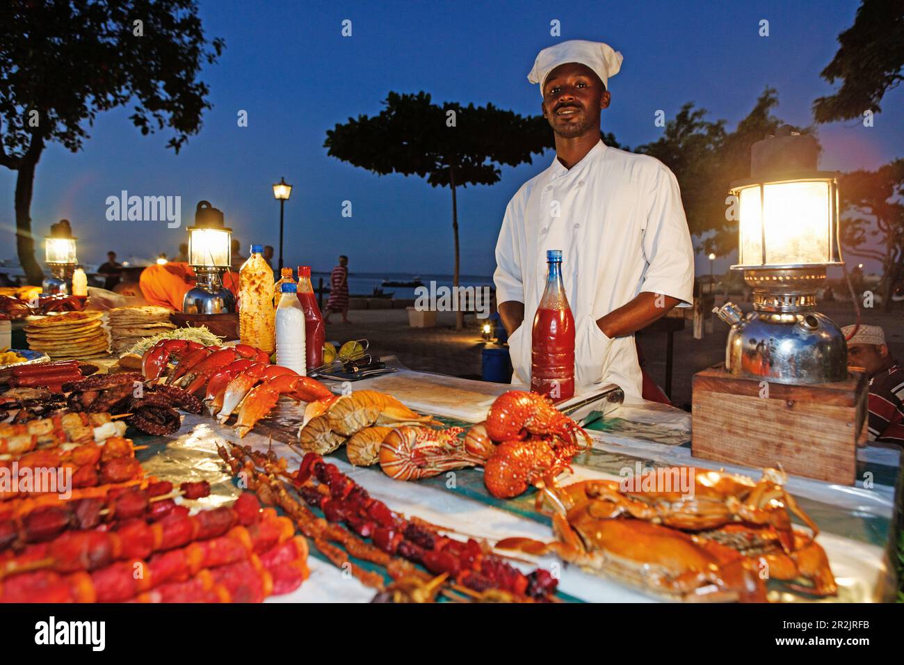 Monger at a stand, night market at Forodhani Gardens, Stonetown ...