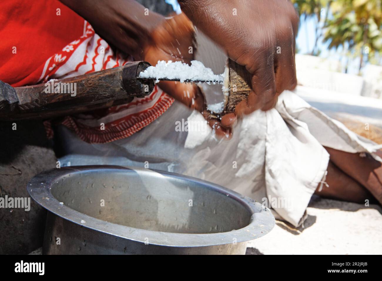 Woman preparing coconut flakes, Jambiani, Zanzibar, Tanzania, Africa ...