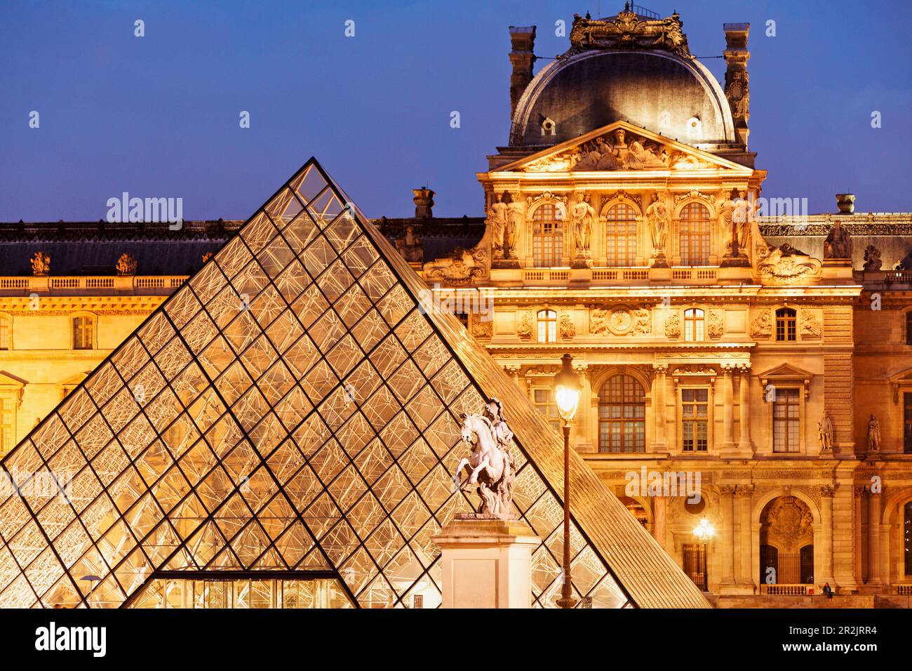 Louvre and the pyramid by I.M. Pei in the evening, Paris, France ...