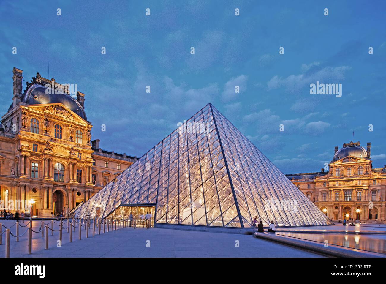 Louvre and the pyramid by I.M. Pei in the evening, Paris, France ...
