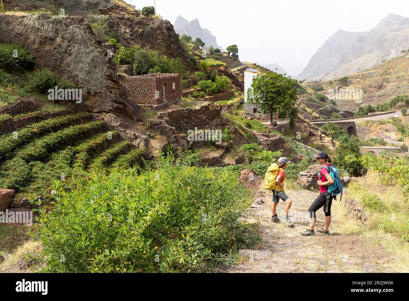 Mother and son, tourists, hikers on a spectacular hiking trail to Cha ...