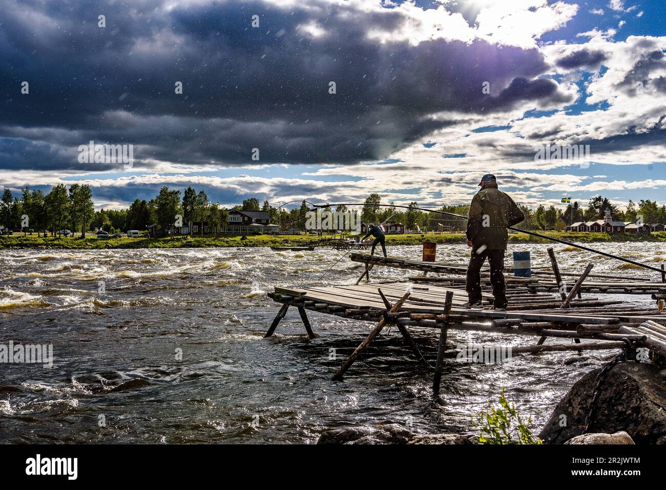 Traditional local fishing with long nets. Kukkolankoski rapids on the ...