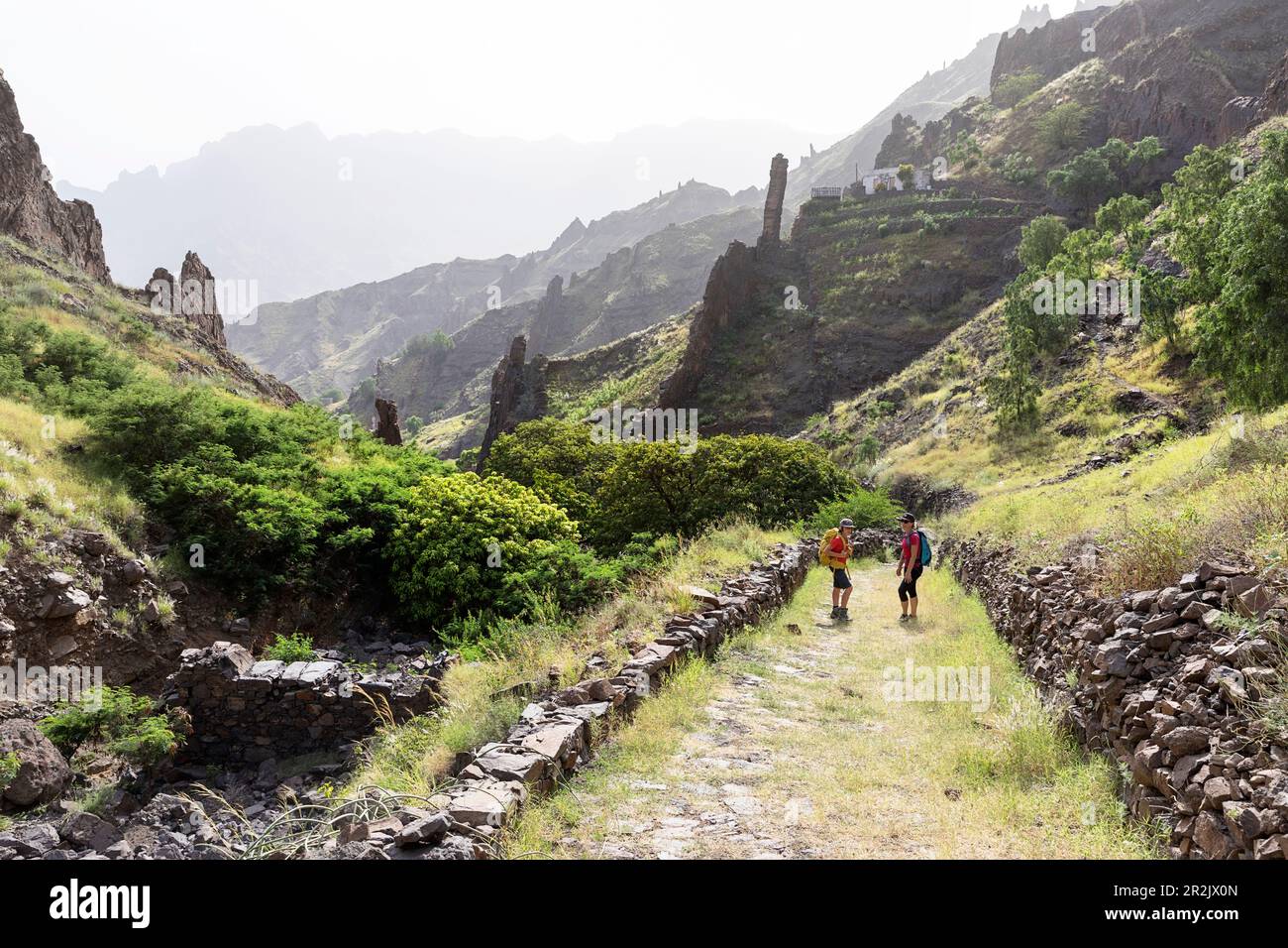 Mother and son, tourists, hikers on a spectacular hiking trail to Cha ...