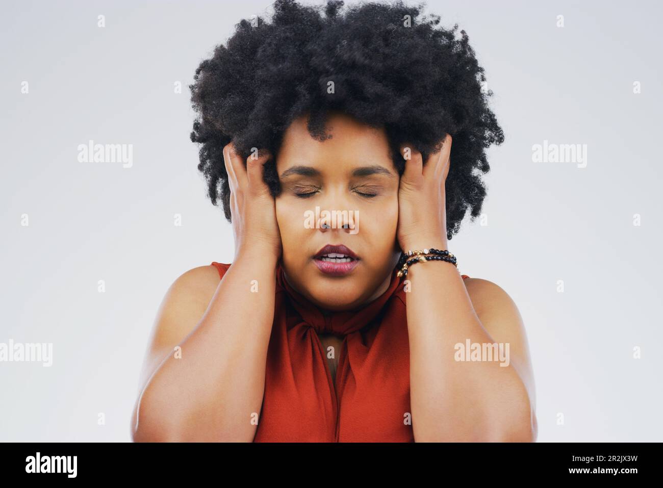 Stress, headache and woman cover ears in studio, white background and ...