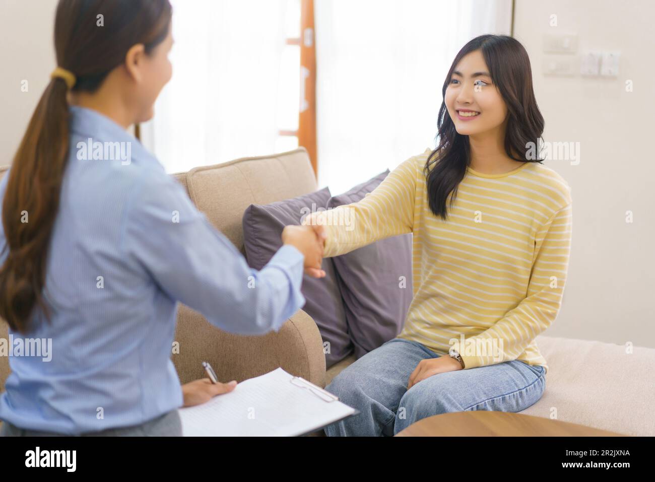 Asian patient doctor handshake hi-res stock photography and images - Alamy