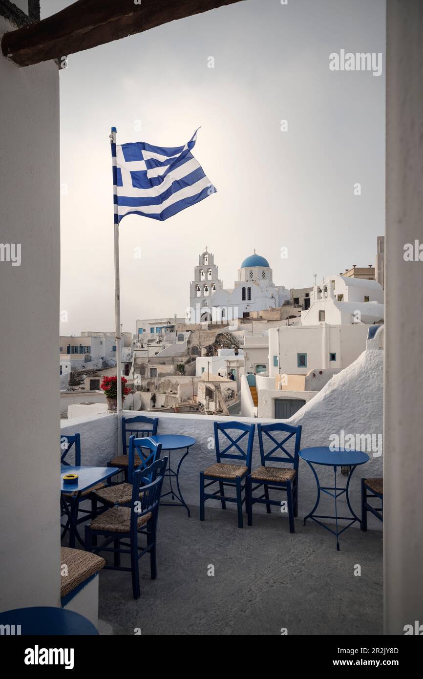 Greek flag in front of Greek Orthodox Church, Pyrgos, Santorini ...