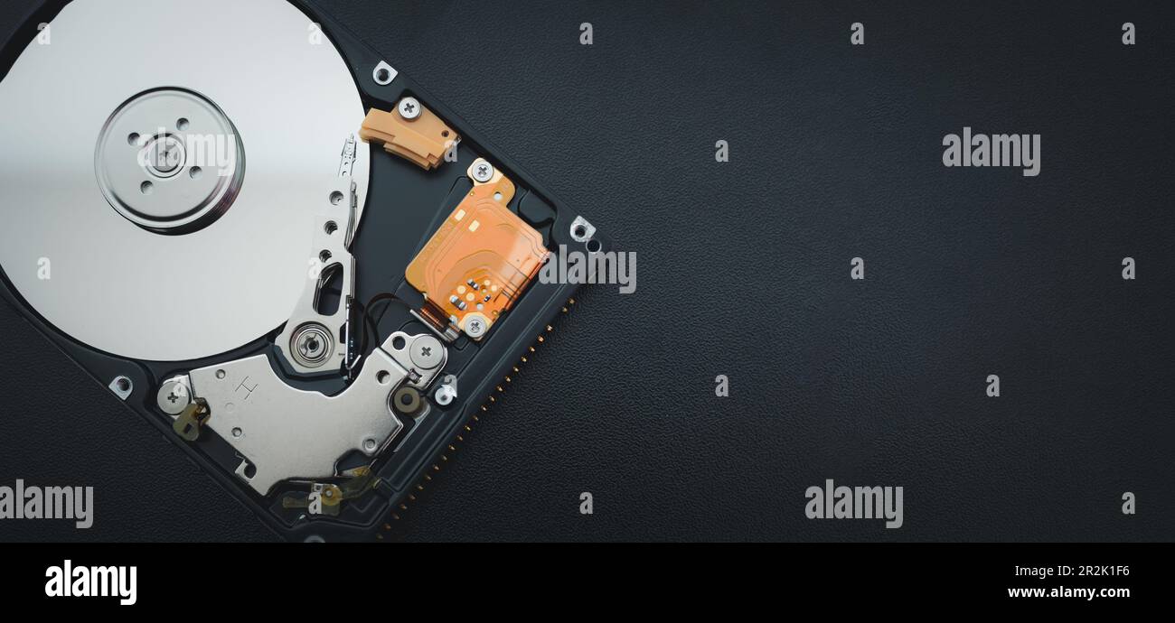 Disassembled open hard disk drive HDD of computer or laptop lies on ...