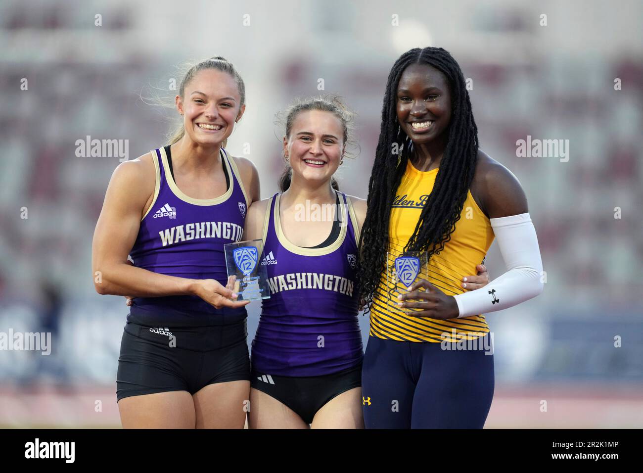 Women's pole vault co-champions Nastassja Campbell (left) and Sara Borton (center) of Washington ...