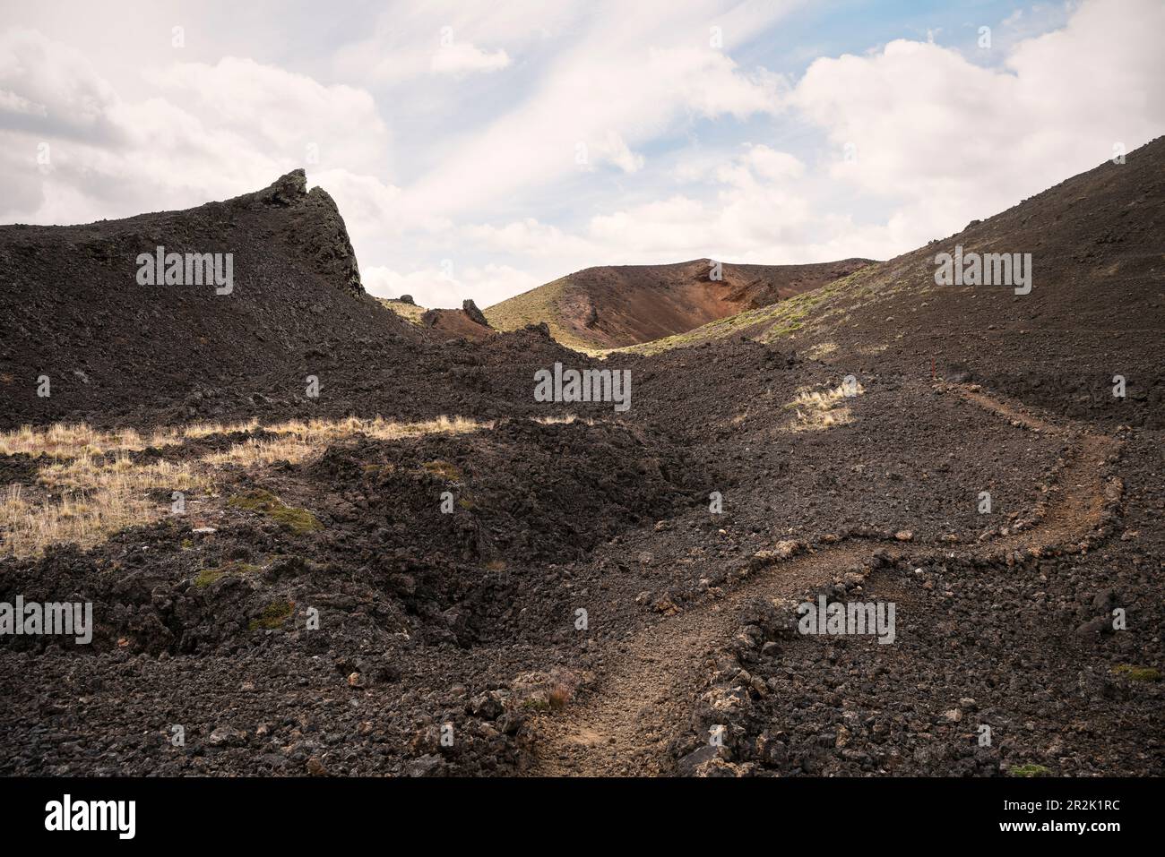 Hiking trail through the volcanic field of Pali Aike National Park ...