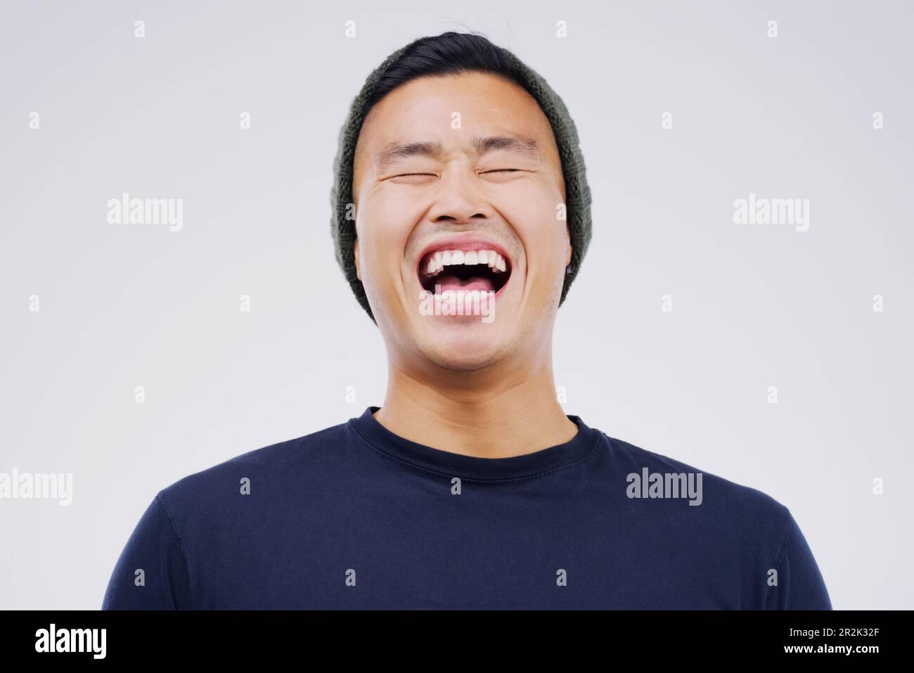 Happy, laughing and man in studio with a casual outfit excited for a ...