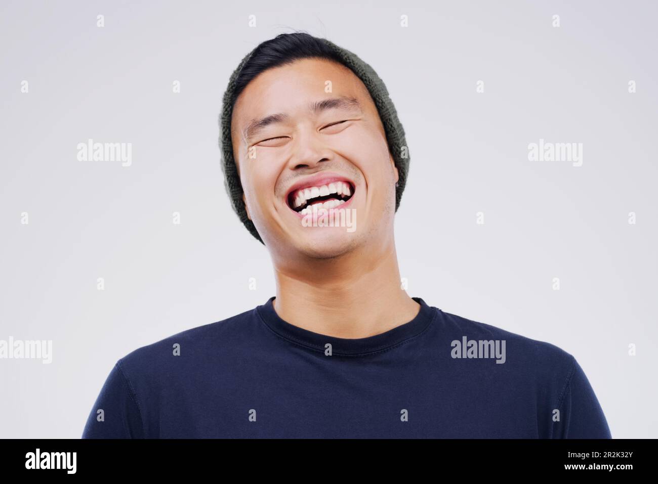 Casual, comedy and man laughing in a studio for joke, comic humor or ...