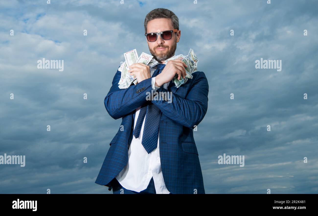 photo of billionaire man show money. billionaire man with money on sky ...