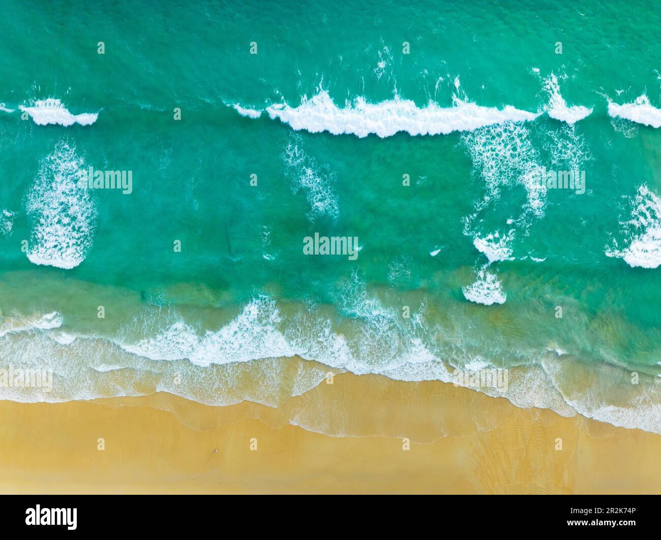 Top view beautiful beach with waves crashing on sandy shore,Amazing sea ...
