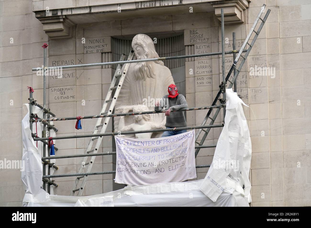 A man wearing a Spiderman mask on scaffolding surrounding the Prospero ...