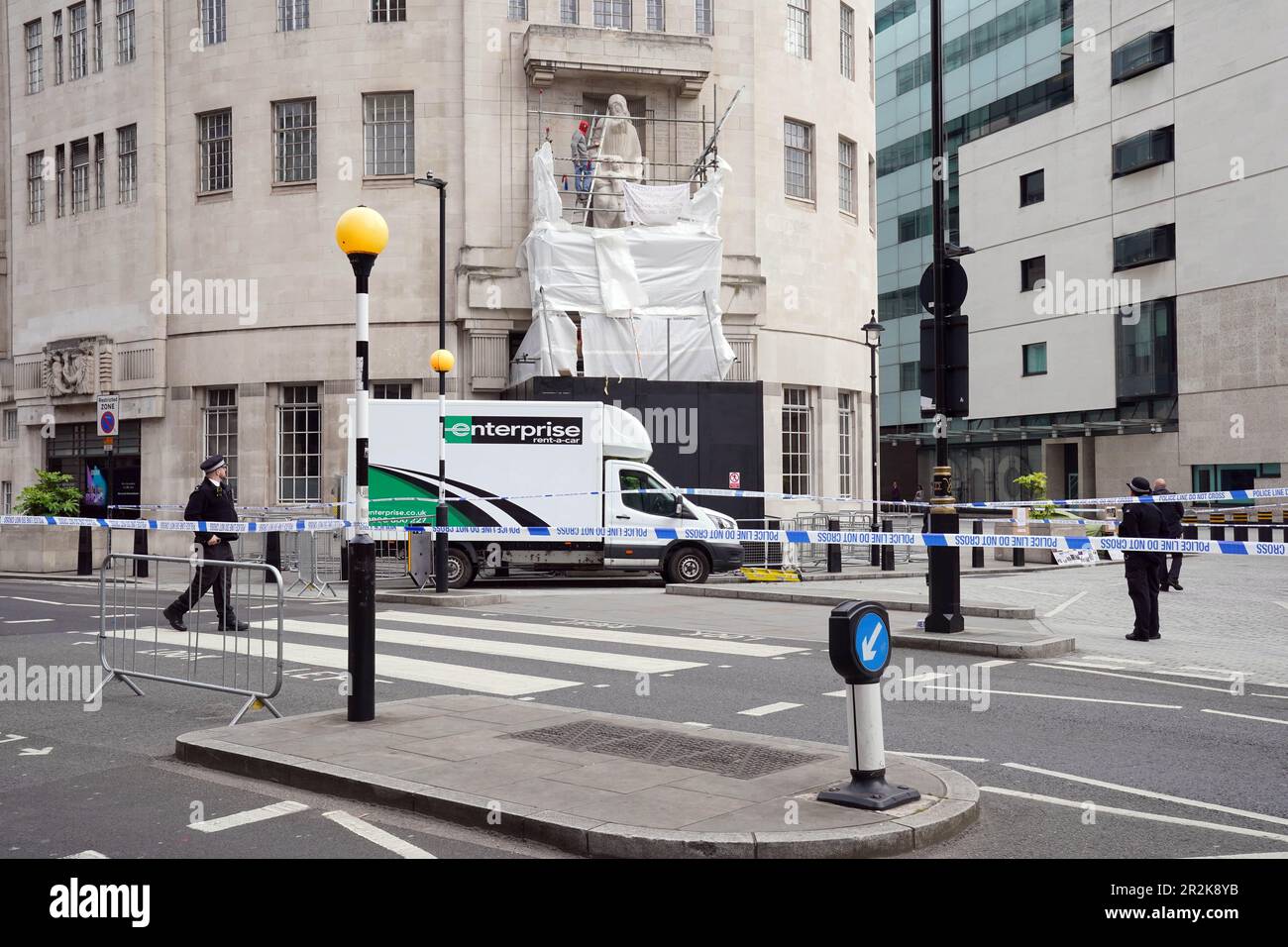 A police cordon outside BBC Broadcasting House in London, as a man ...