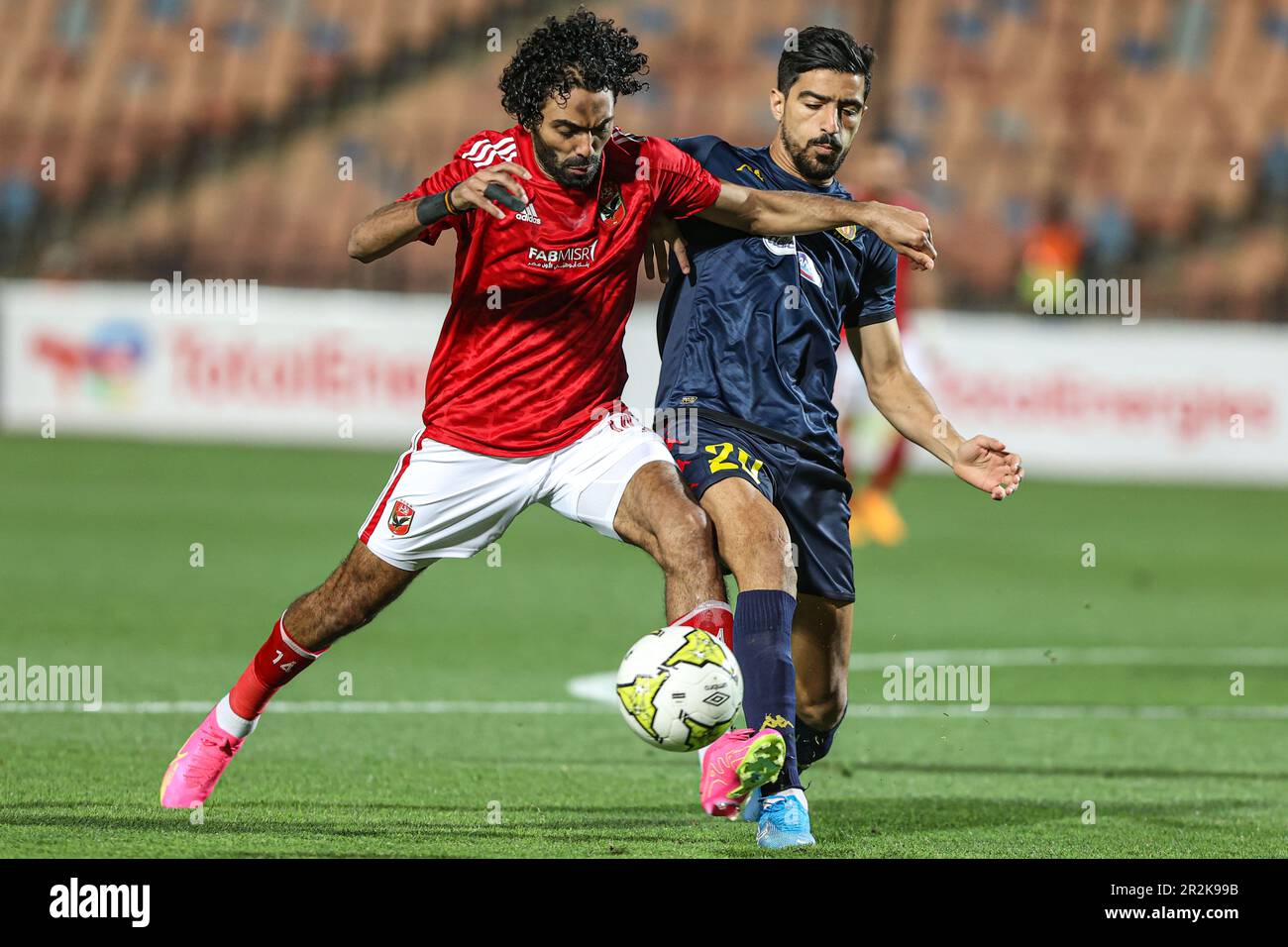 Cairo, Egypt. 19th May, 2023. Hussein El Shahat (L) of Al Ahly competes ...
