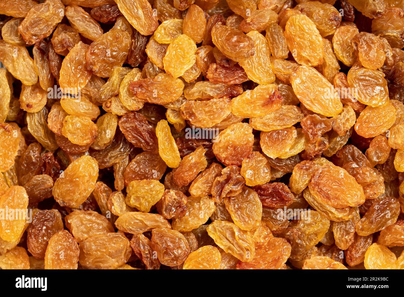 Raisins. Sun-dried yellow grapes closeup food background. Top view ...