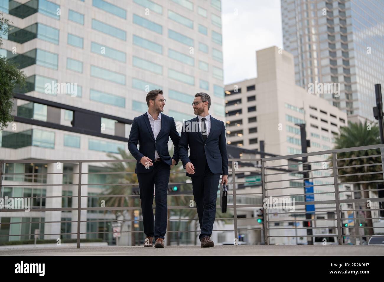 successful business leader boss walking outdoor. photo of two ...