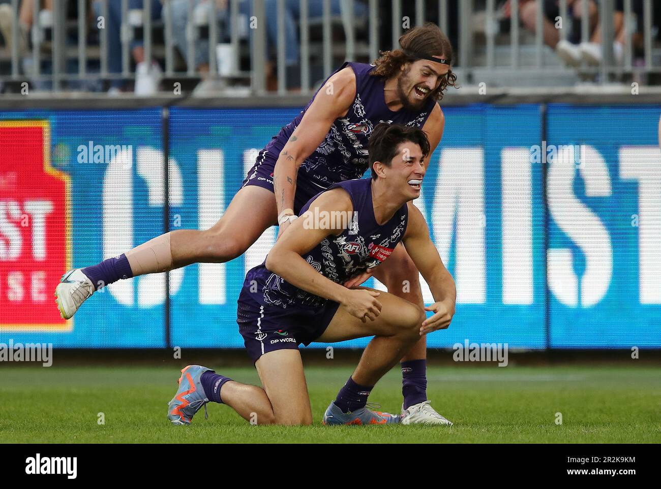 Bailey Banfield of the Dockers is congratulates by Luke Jackson of the ...