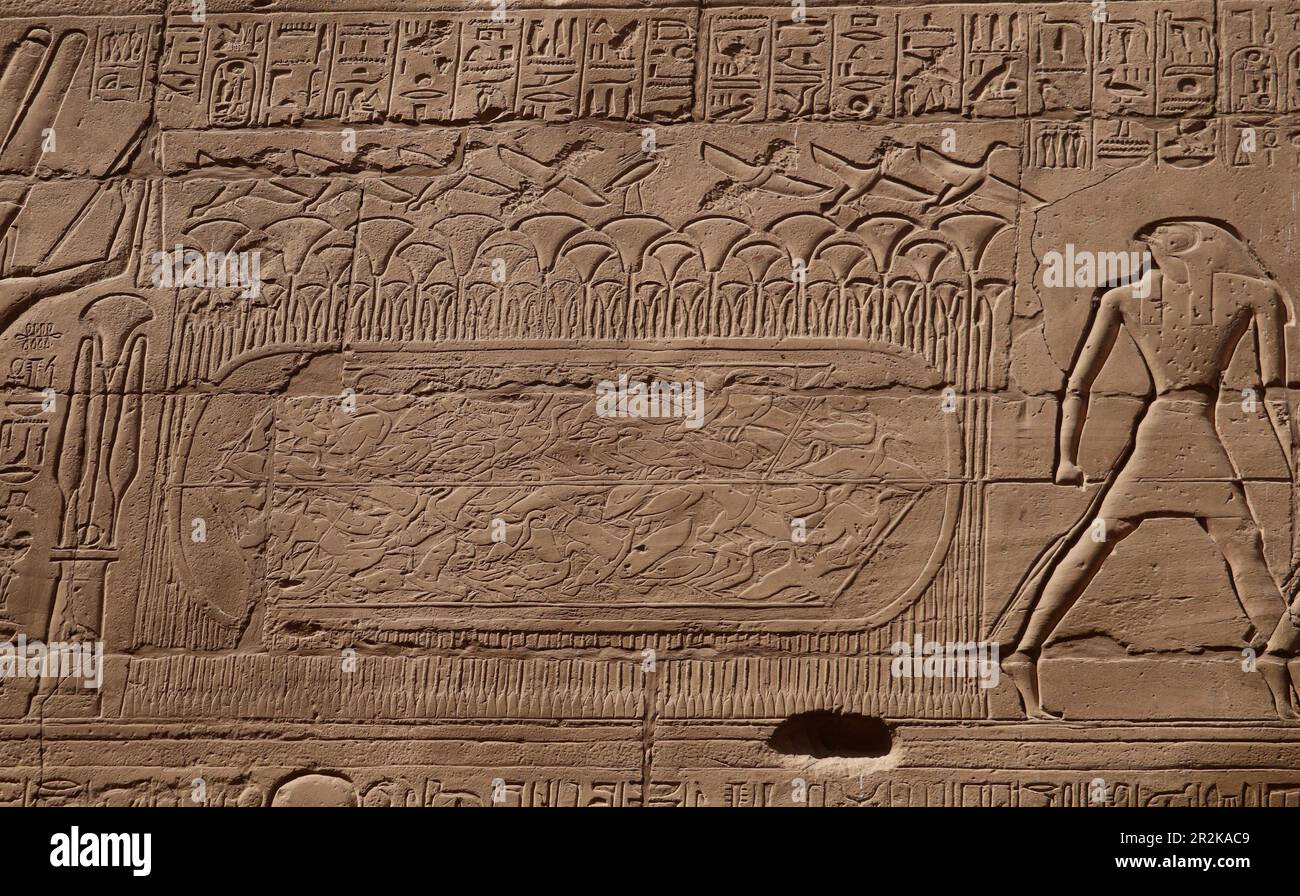 Ancient egyptian symbols and hieroglyphs carved at walls of Karnak ...