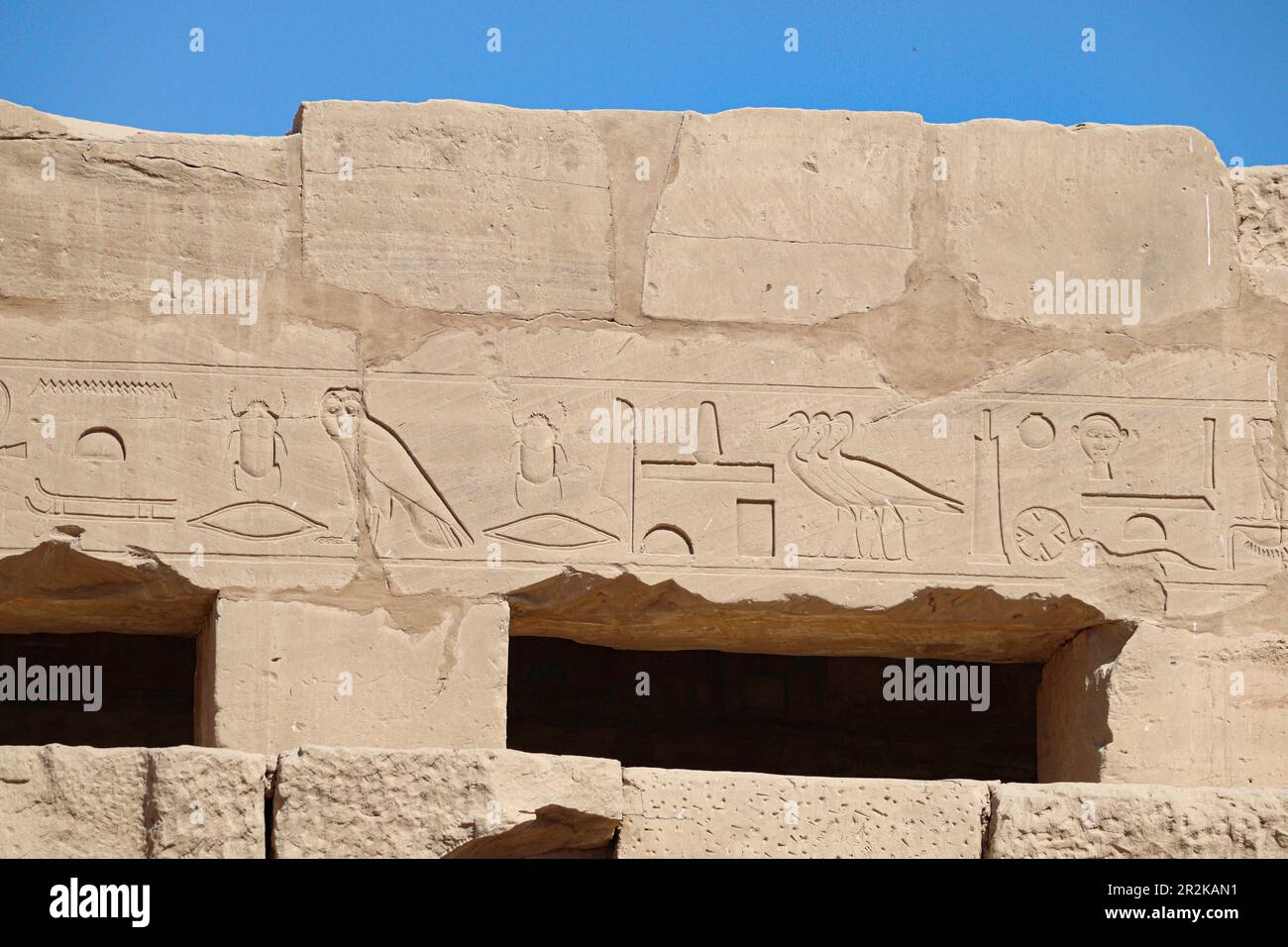 Ancient egyptian symbols and hieroglyphs carved at walls of Karnak ...