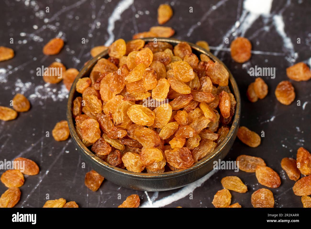 Raisins. Sun-dried grapes in bowl. superfood. Vegetarian food concept ...