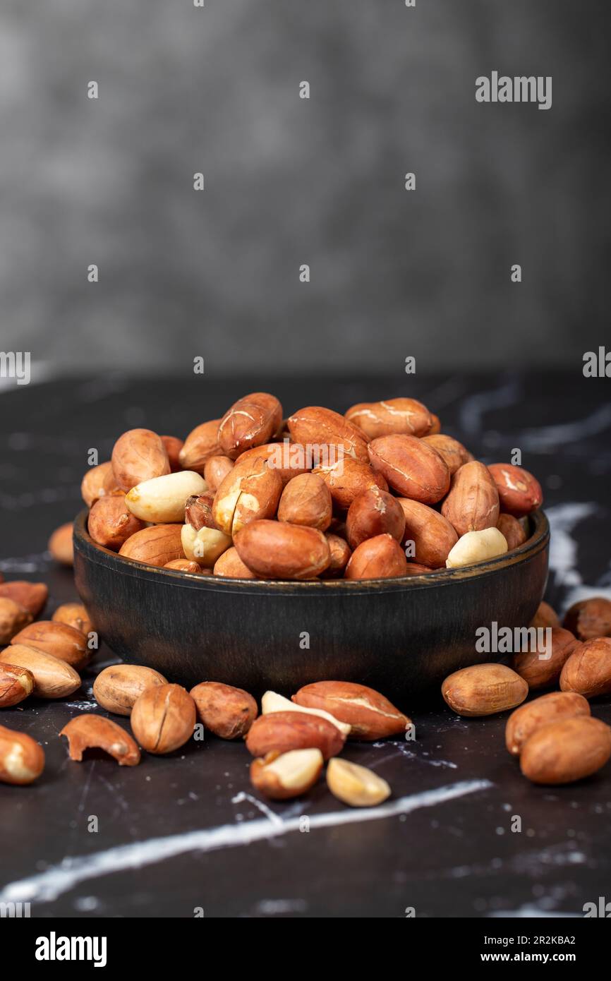 Peanut. Peanuts peeled in bowl. superfood. Vegetarian food concept ...