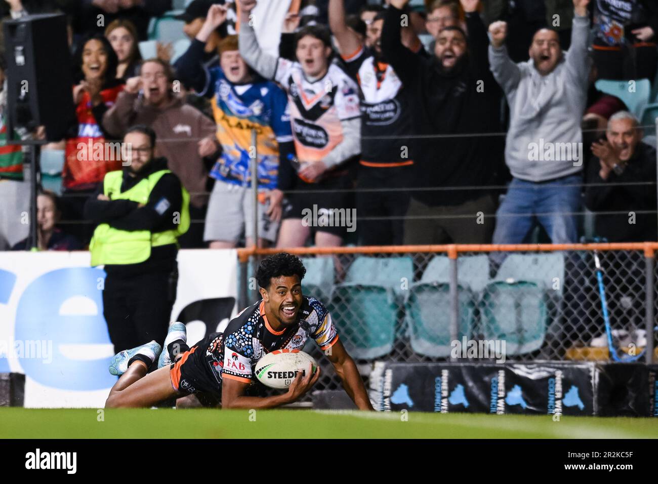 Jahream Bula of the Wests Tigers scores during the NRL Round 12 match ...