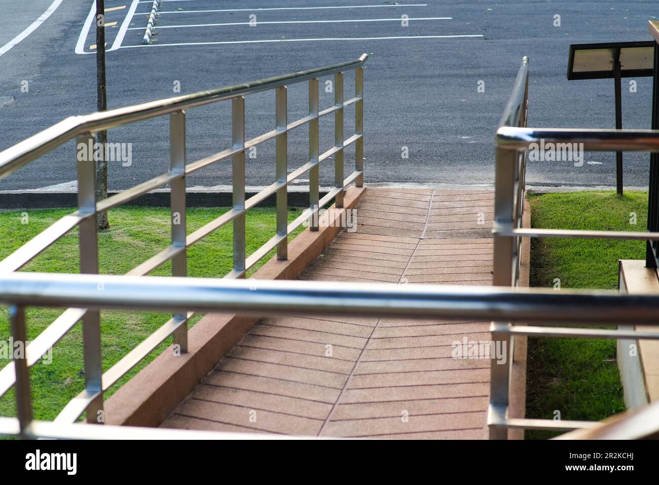 Stone ramp way with stainless steel handrail for support wheelchair ...