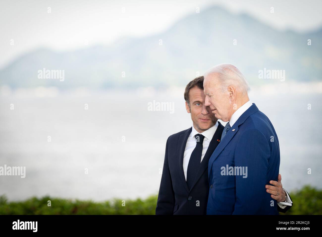 French President Emmanuel Macron (left) speaks with U.S. President Joe ...