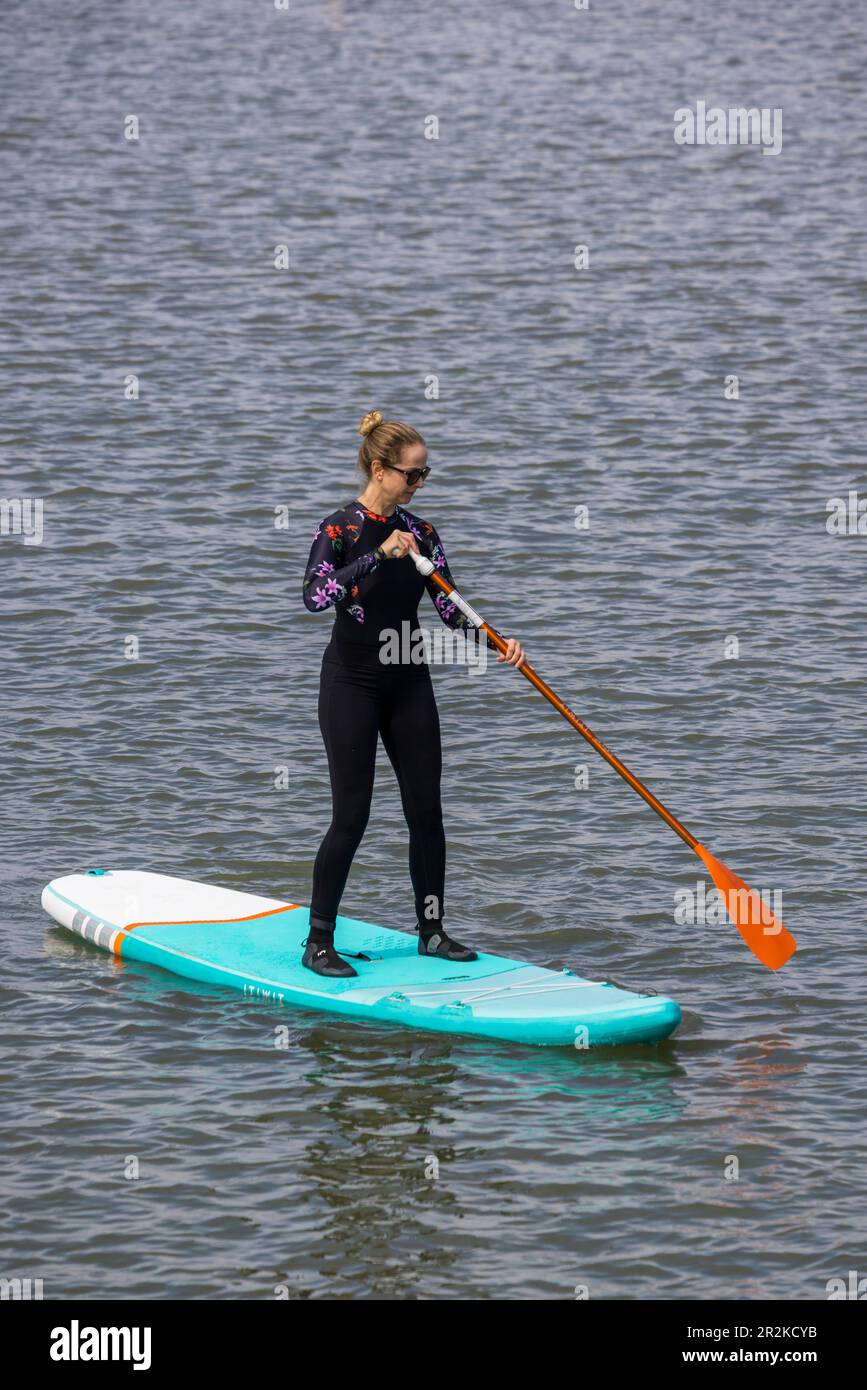 Lady paddle boarding on Marine Lake Stock Photo - Alamy