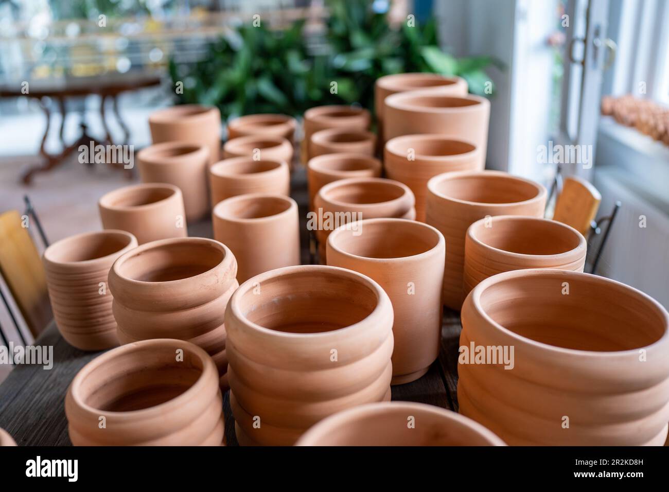 Terracotta pots in different sizes in plant shop Stock Photo - Alamy