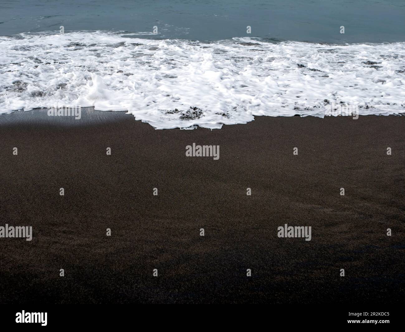 Dark sandy seashore on Parangtritis Beach, in Yogyakarta, Indonesia ...