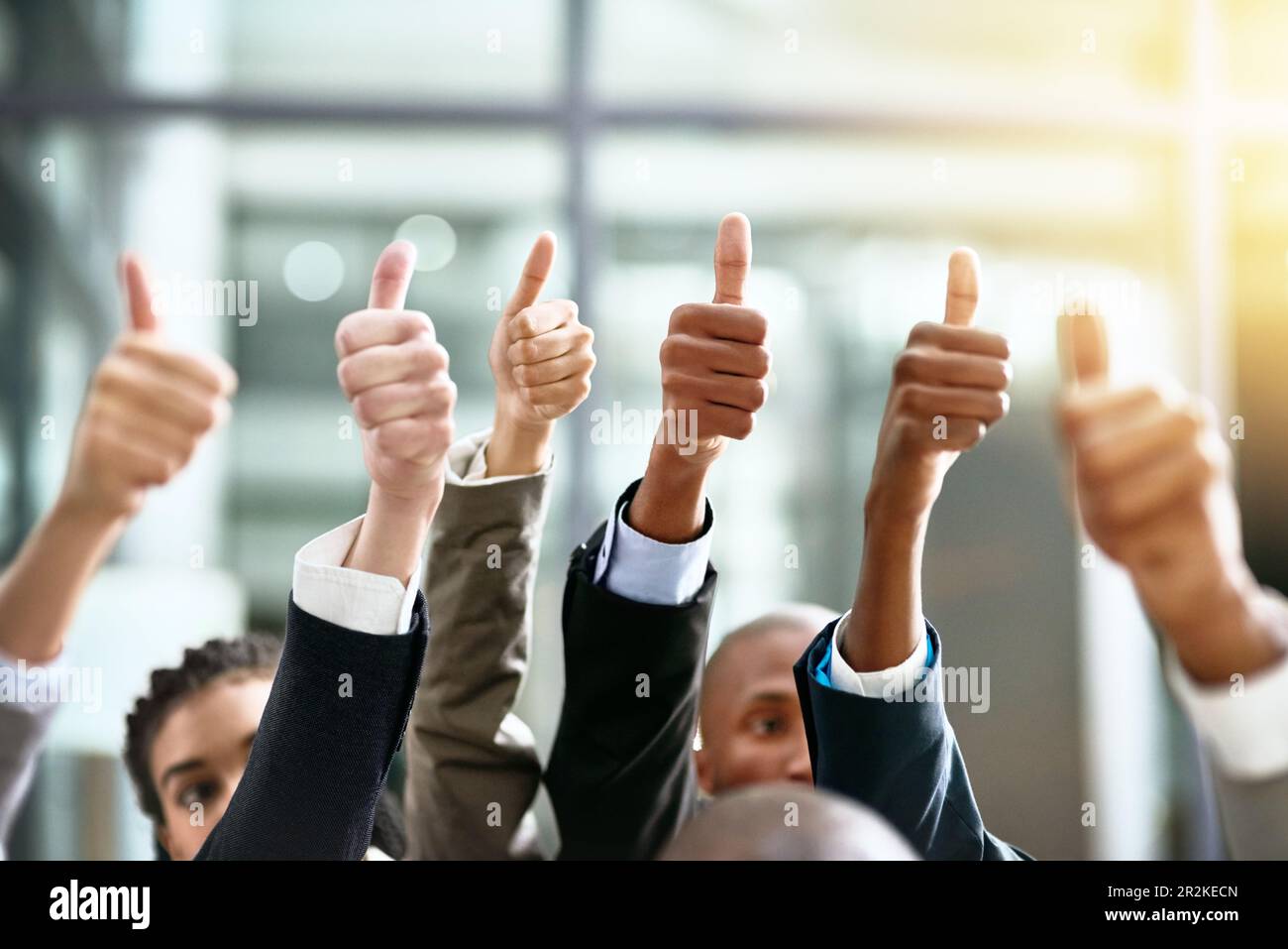 Winner, thumbs up and group of people thank you, support or teamwork ...