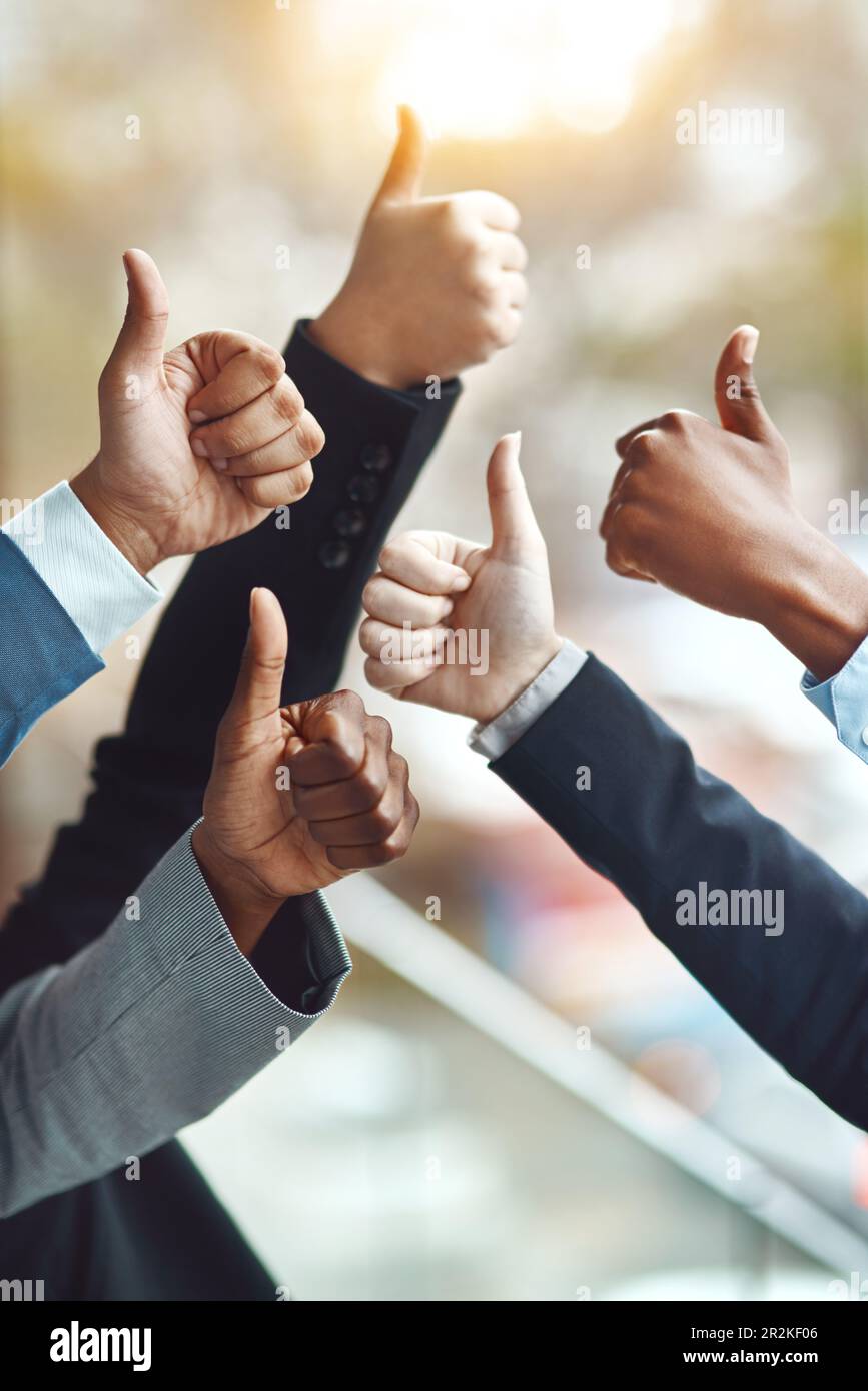 Teamwork, hands and community with thumbs up for success, team building and motivation. Business ...