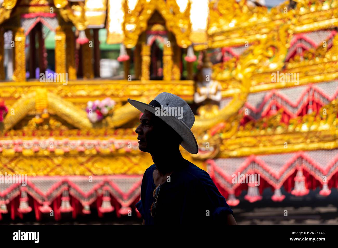 May 20, 2023, Yasothon, Yasothon, Thailand: A festival goers stands in ...