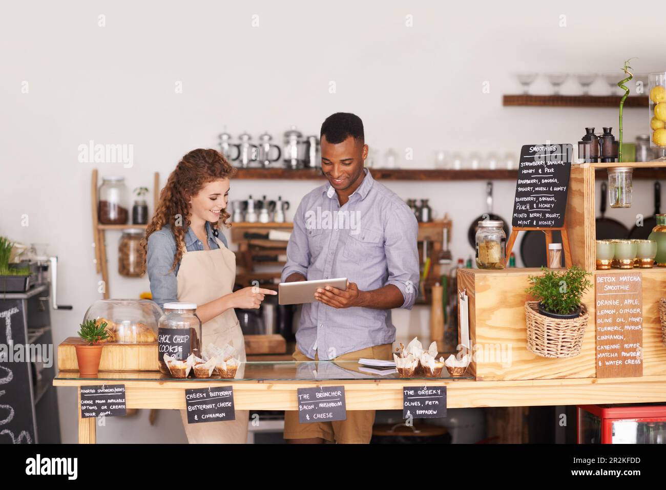 Restaurant owners, tablet and teamwork of people, manage orders and ...